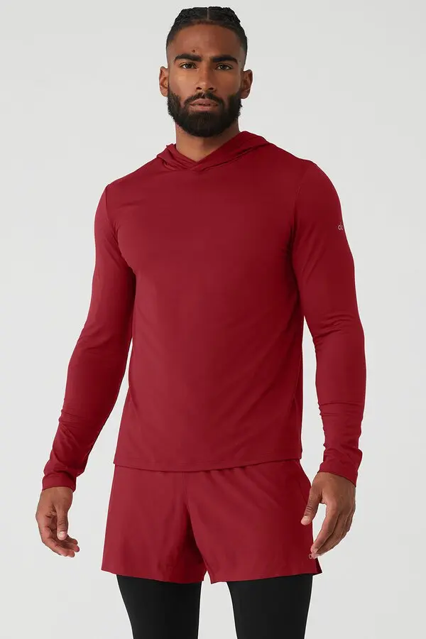 Alo Yoga Conquer Reform Long Sleeve With Hood Top In Victory Red